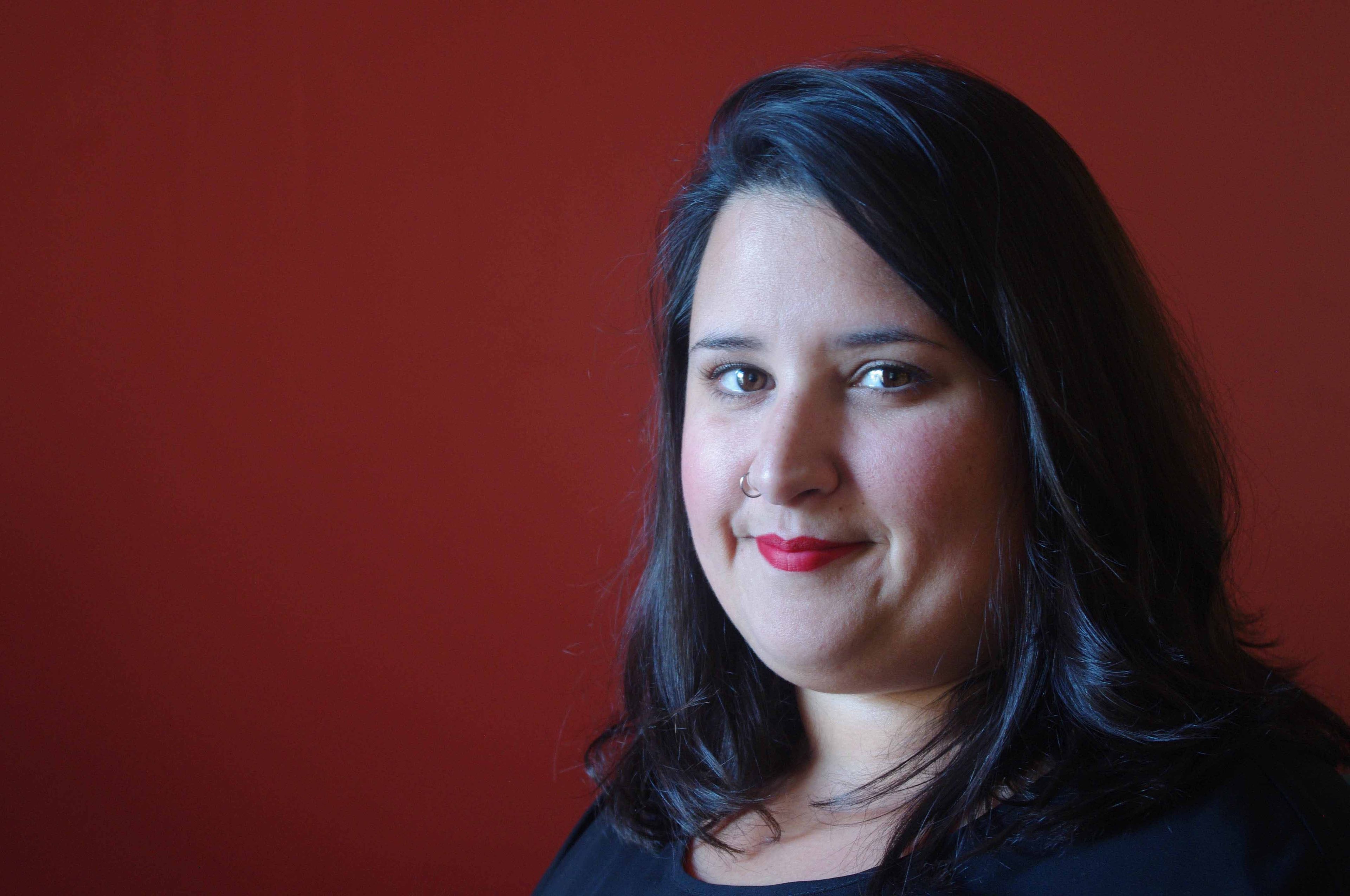 stephanie headshot in a red room